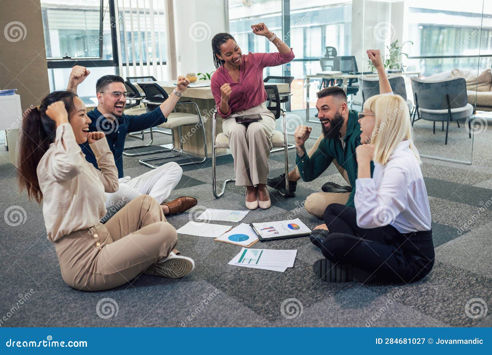 Professional People Sitting on the Floor of the Office and Working ...