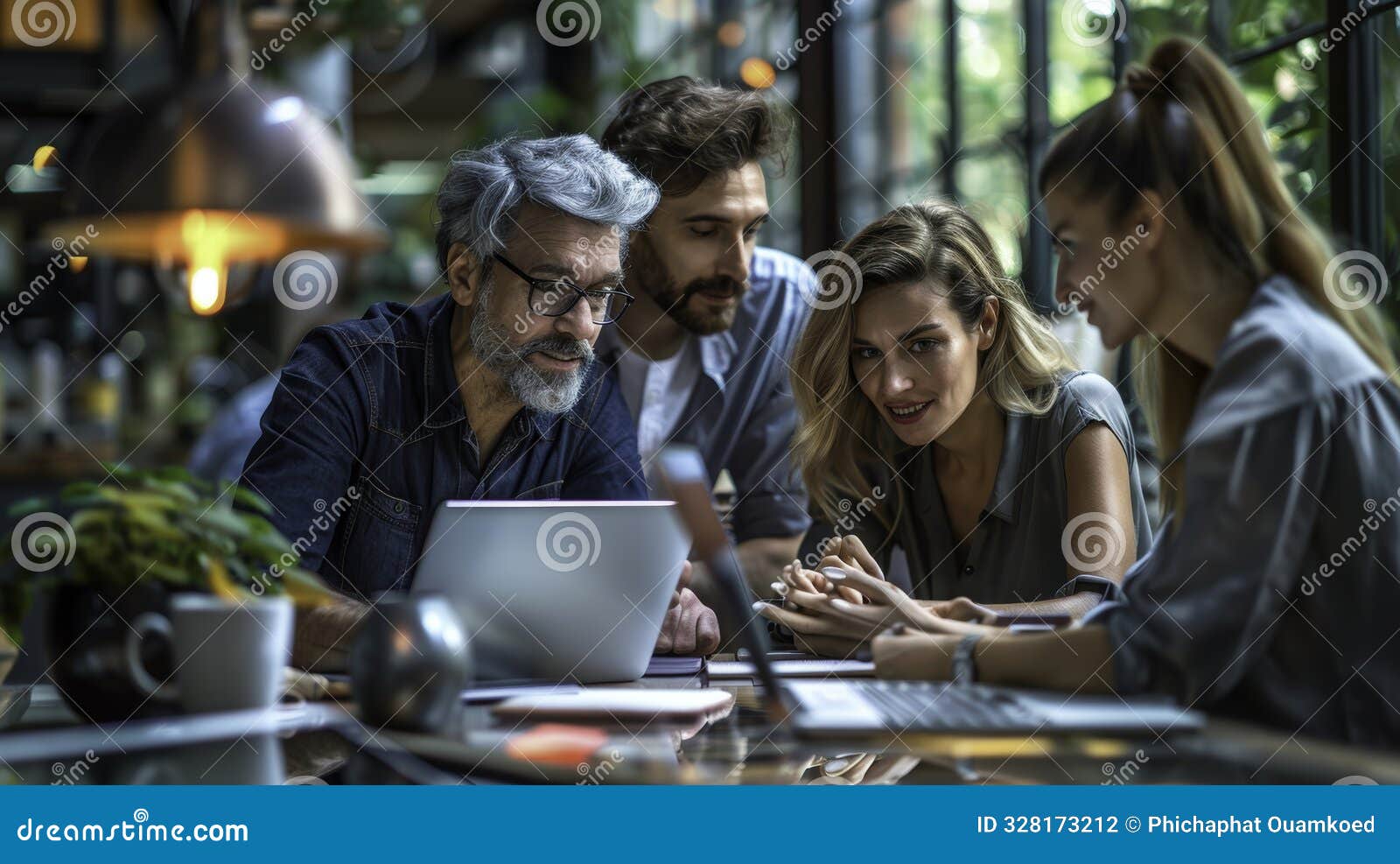 A Group of Professionals Collaborating on a Project in a Modern ...