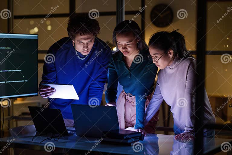 Group of Programmers Solving Problem in Evening Stock Photo - Image of cowork, meeting: 309241910