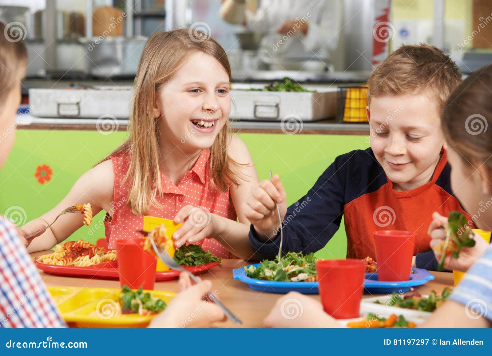 Group of Pupils Sitting at Table in School Cafeteria Eating Lunch Stock ...