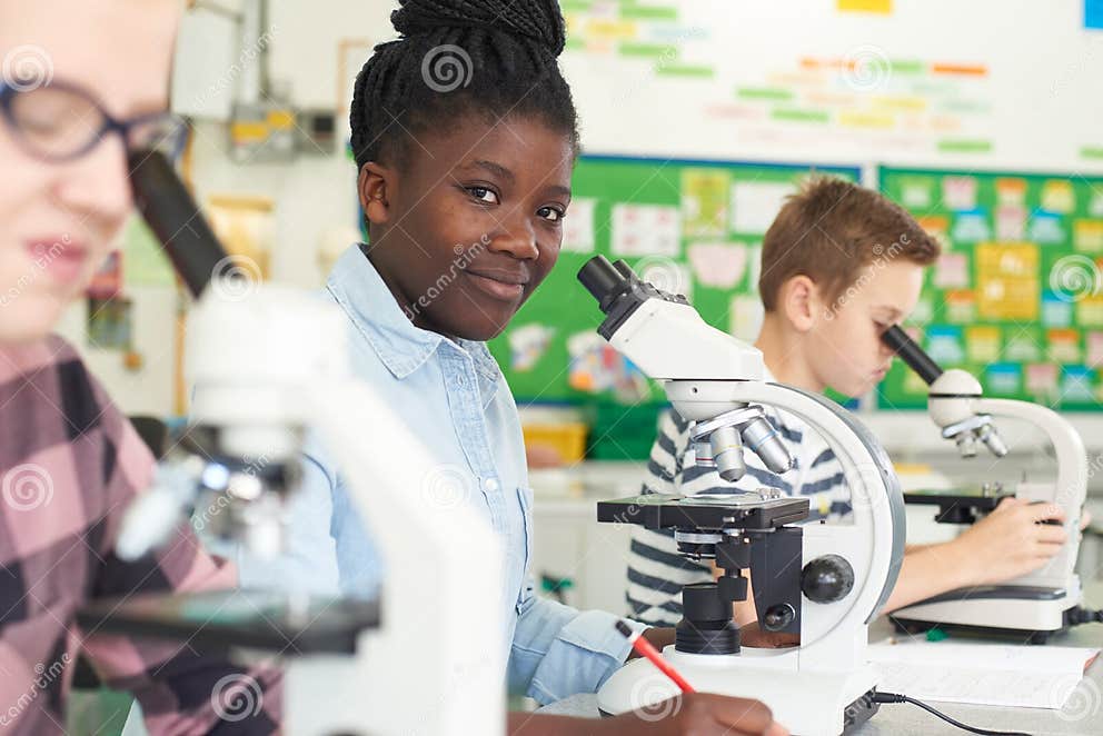 Group of Pupils Using Microscopes in Science Class Stock Photo - Image ...