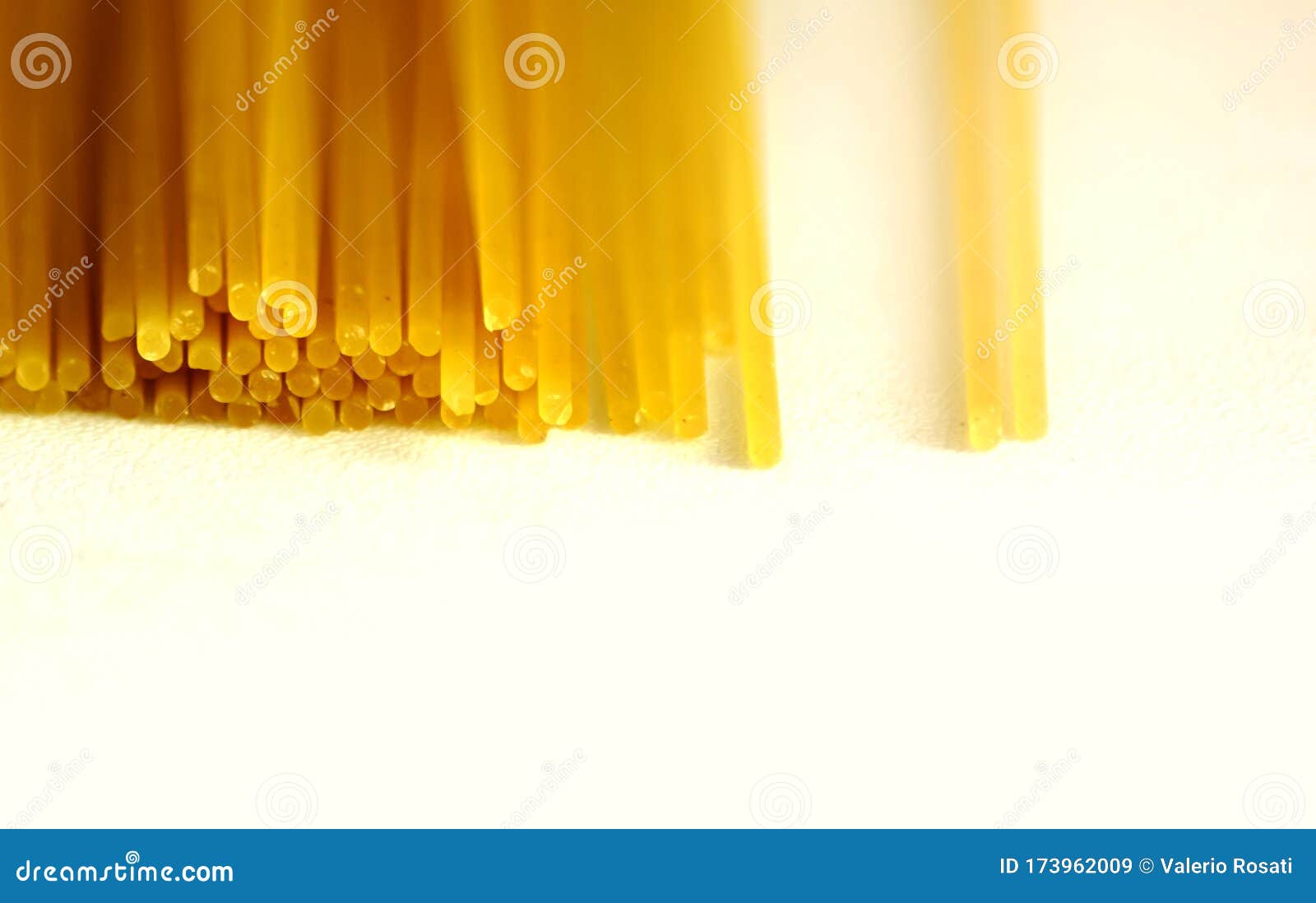 A Group of Raw Spaghetti Stacked on a White Surface Stock Image - Image ...