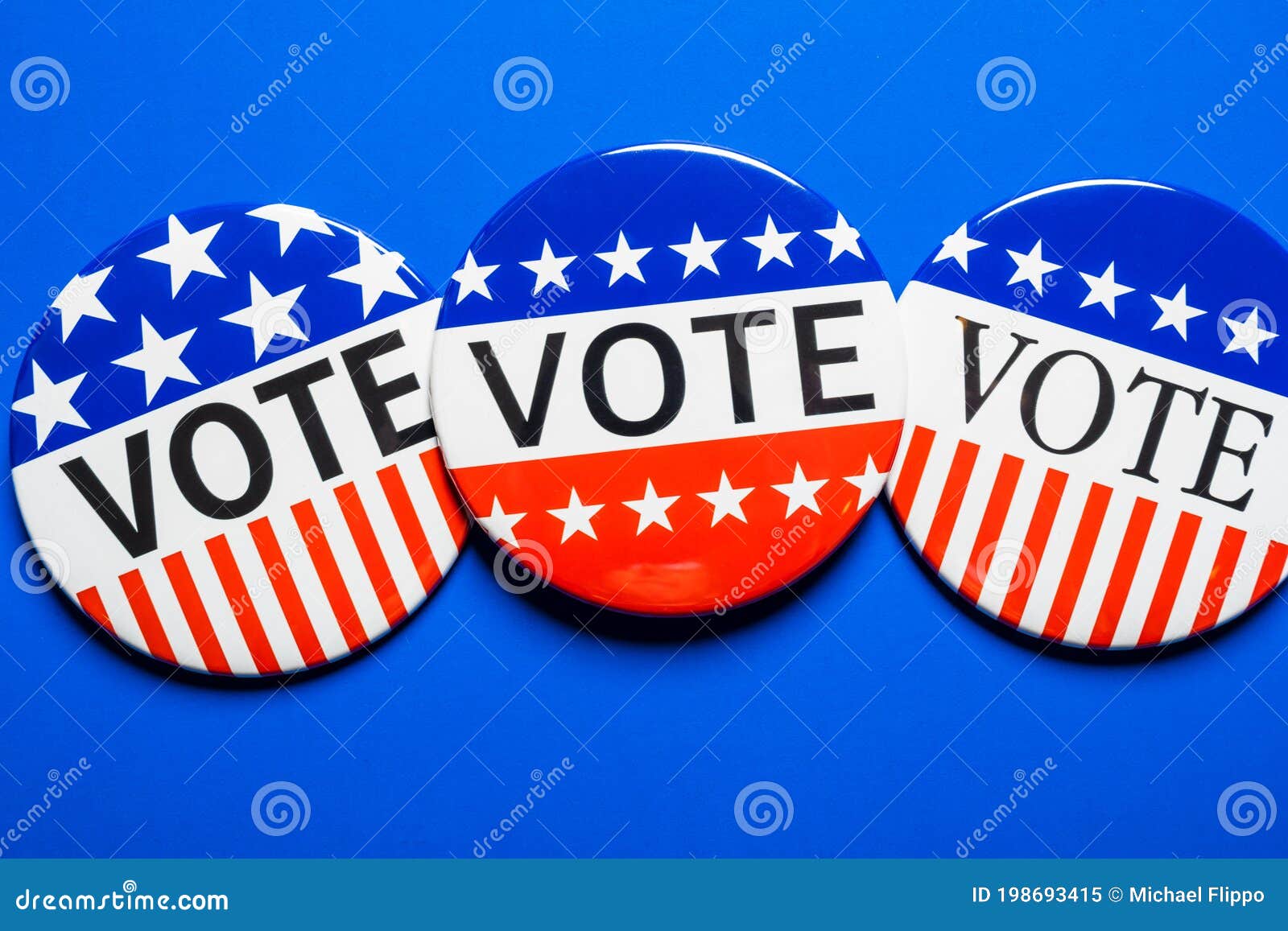 A Group of Red, White and Blue VOTE Button on a Blue Background Stock ...