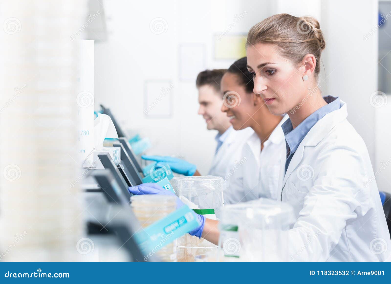 Group of Researchers during Work on Devices in Laboratory Stock Photo ...