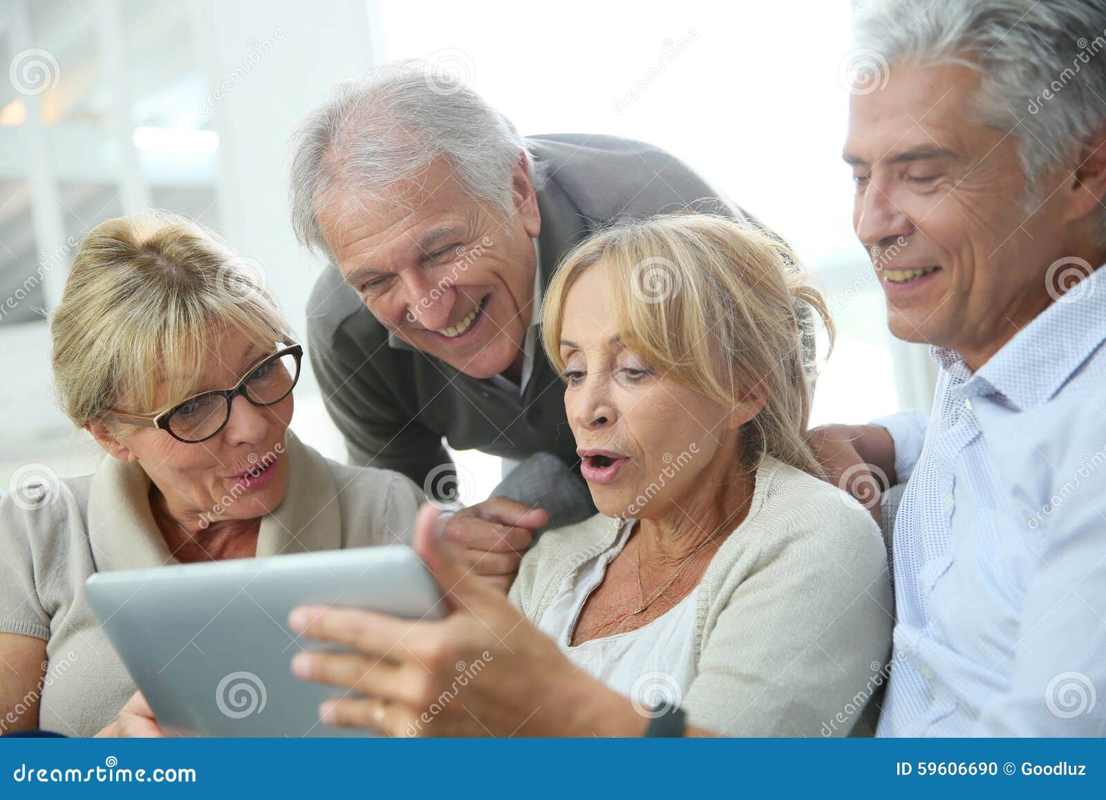 Group of Retired People Having Fun Using Tablet Stock Photo - Image of ...