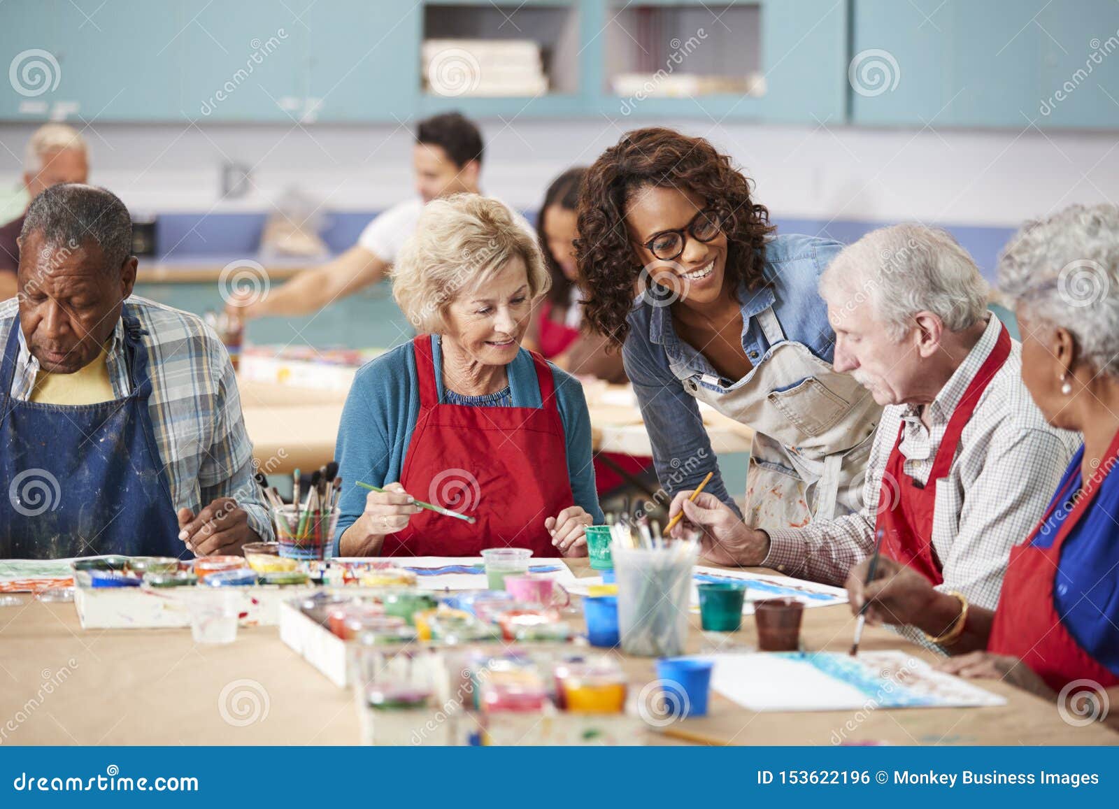 Group of Retired Seniors Attending Art Class in Community Centre with ...