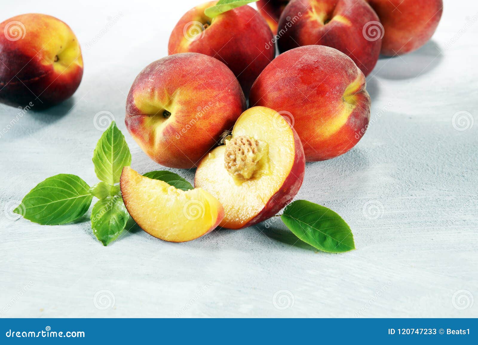 A Group of Ripe Peaches on Table Stock Image - Image of green, concept ...