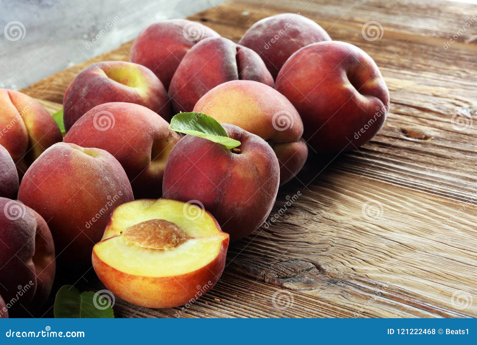 A Group of Ripe Peaches on Table Stock Photo - Image of orange, leaf ...