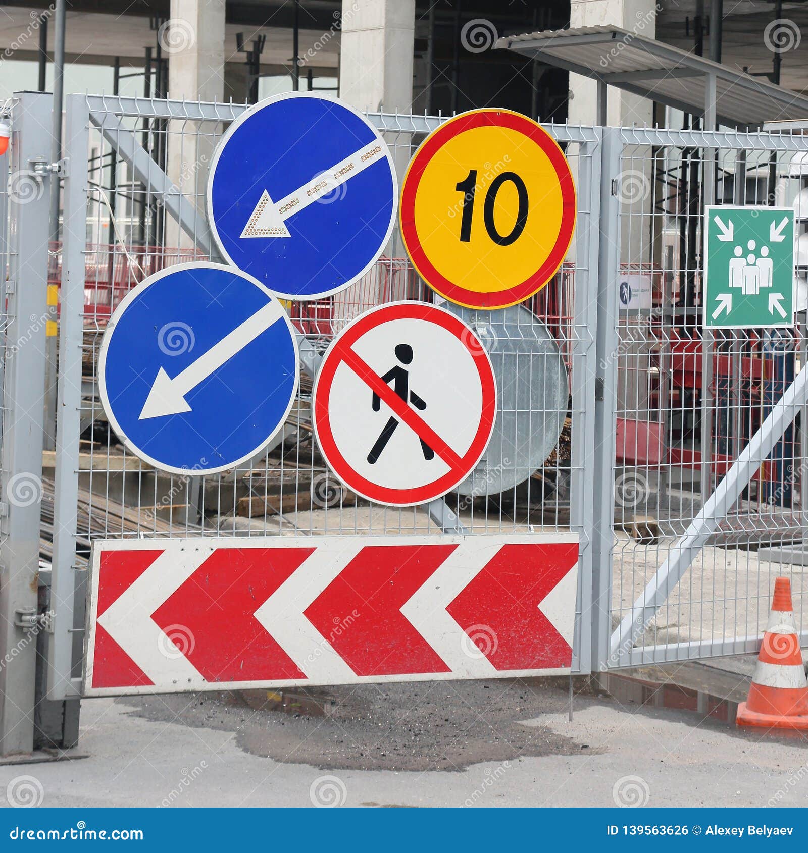 Group of Road Traffic Signs on the Metal Gate of the Construction Site ...