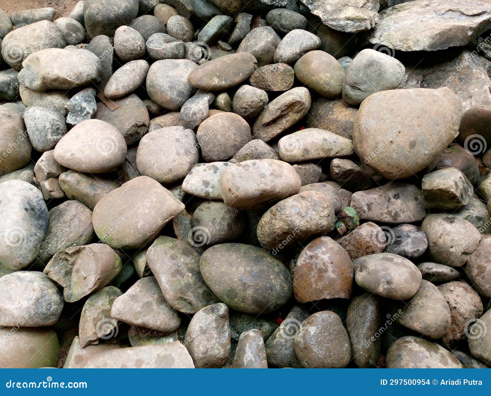 A Group of Rounded River Rocks Stock Photo - Image of source, sand ...