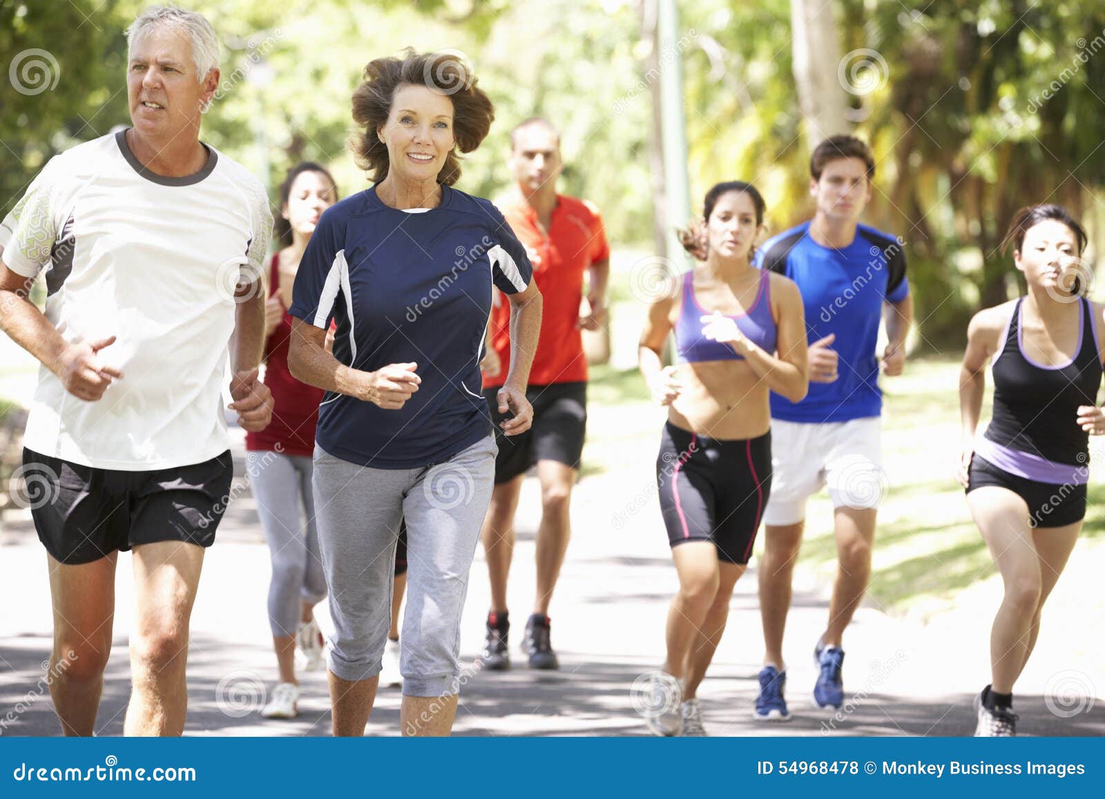 Group of Runners Jogging through Park Stock Photo - Image of happy ...