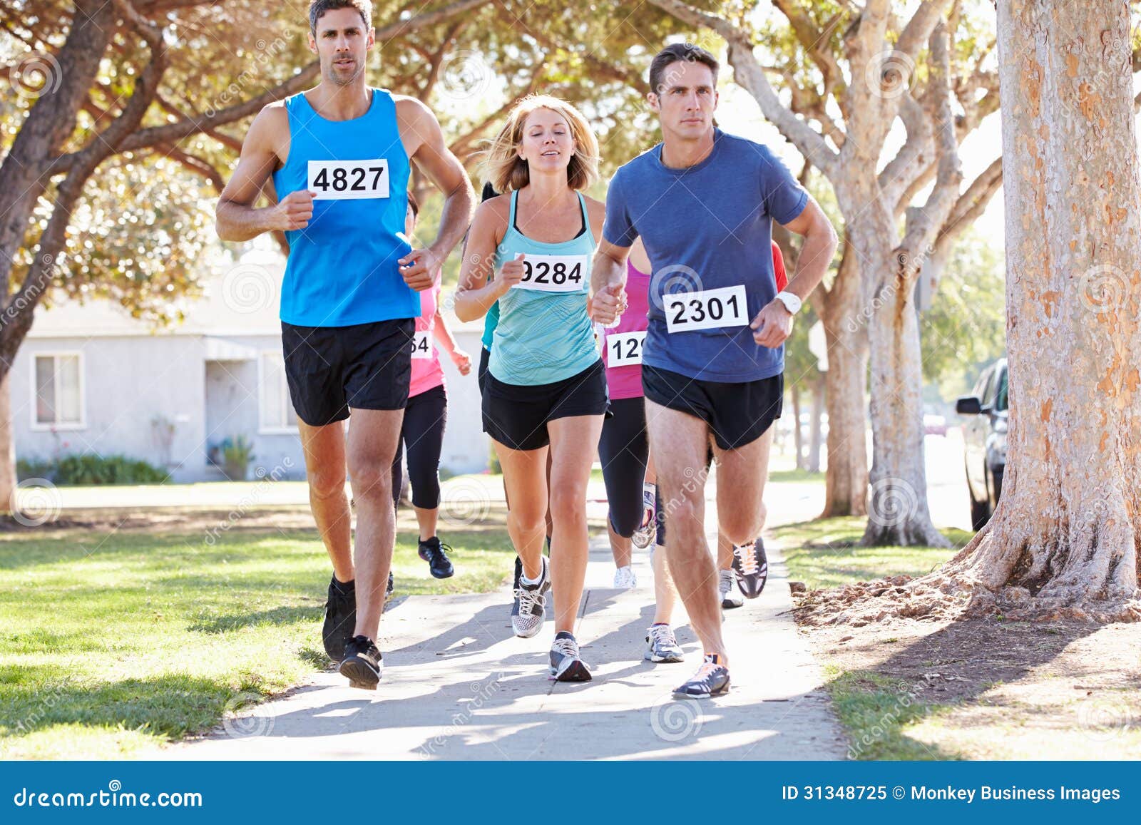 Group of Runners on Suburban Street Stock Image - Image of female ...