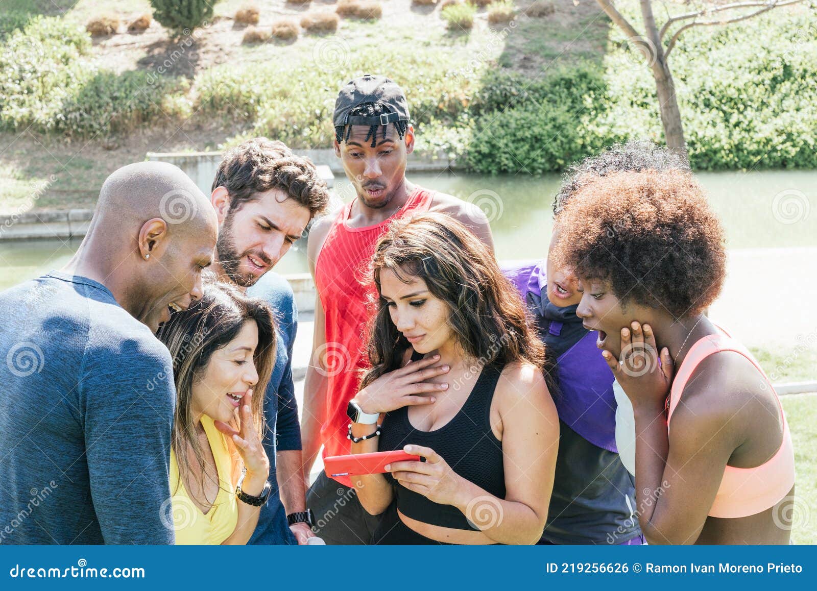 Group of Runners Very Surprised when Looking at Something on a Mobile ...
