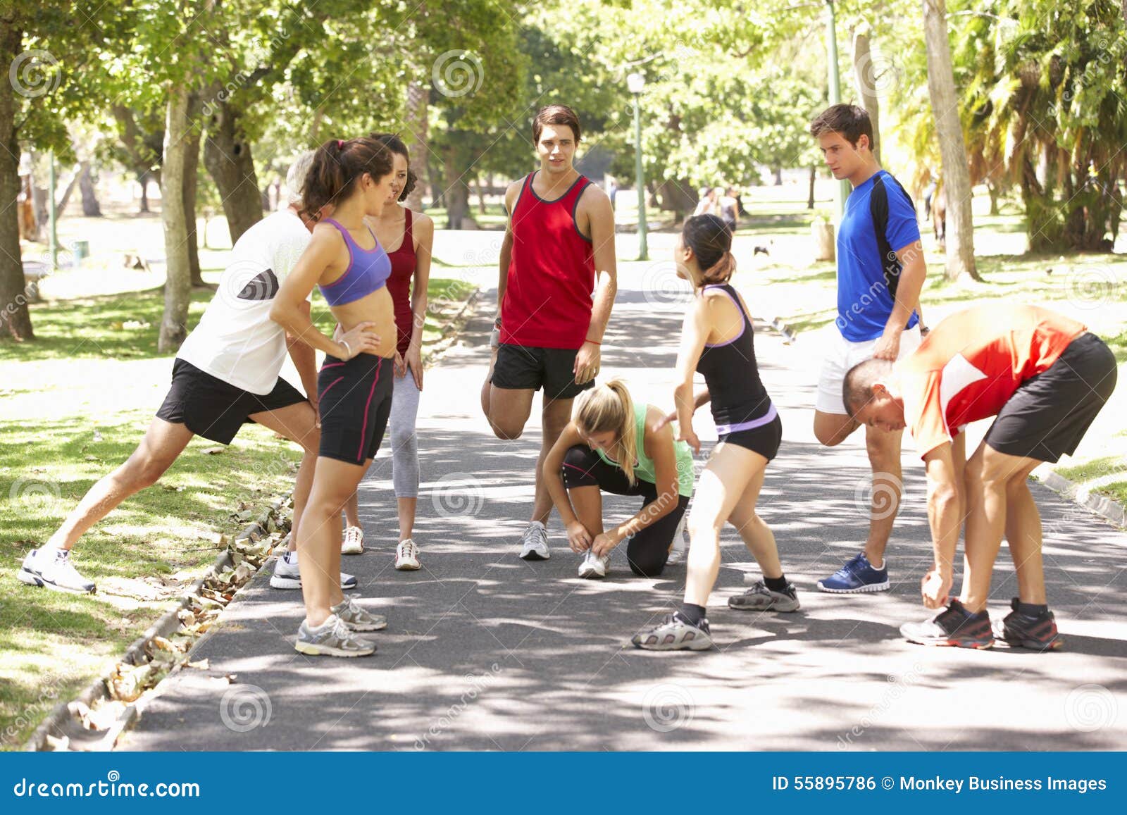 Group of Runners Warming Up in Park Stock Photo - Image of outdoors ...