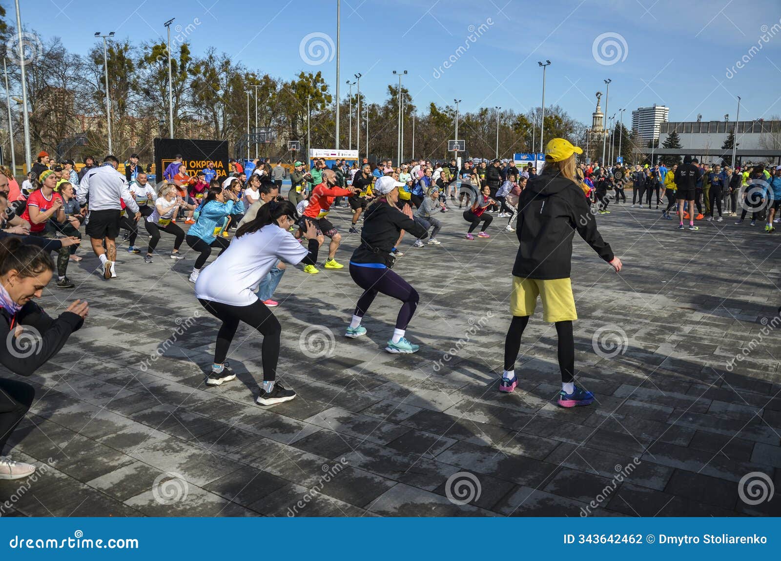 Group of Runners Warming Up and Stretching before the Running Editorial ...