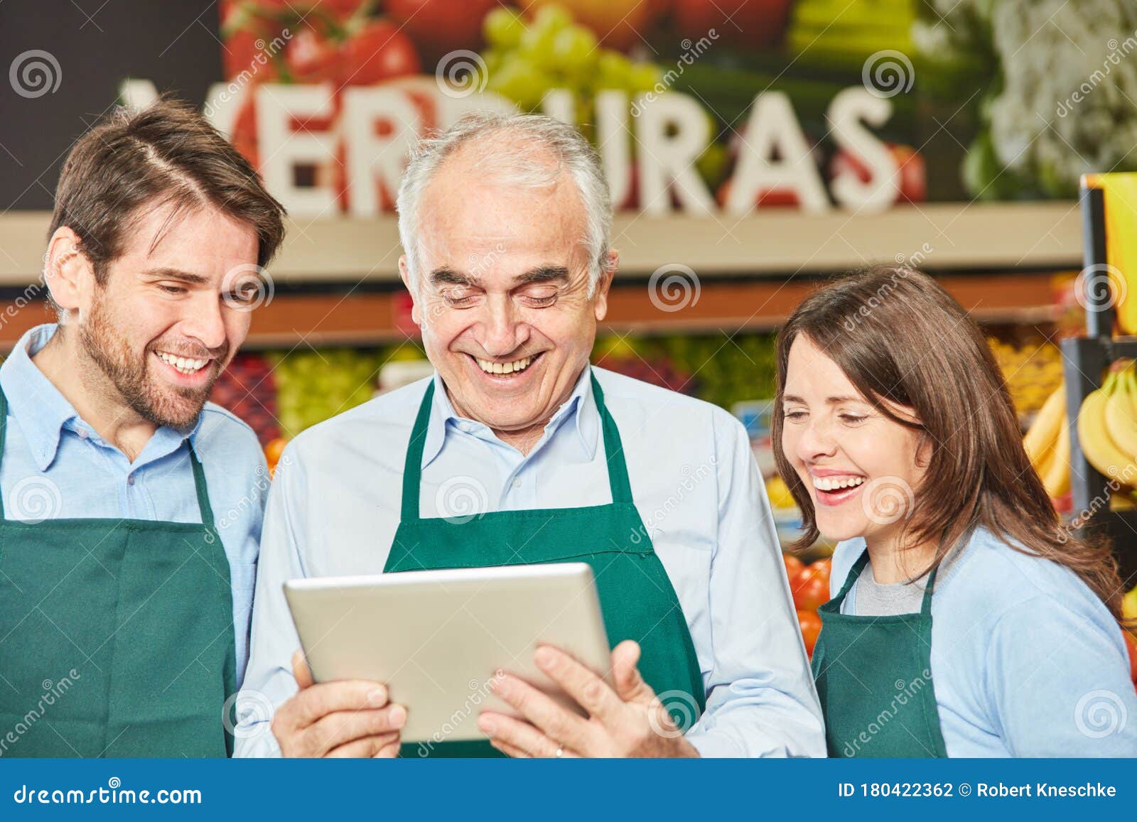 Group Salesman with Trainee at Tablet Computer Stock Photo - Image of ...