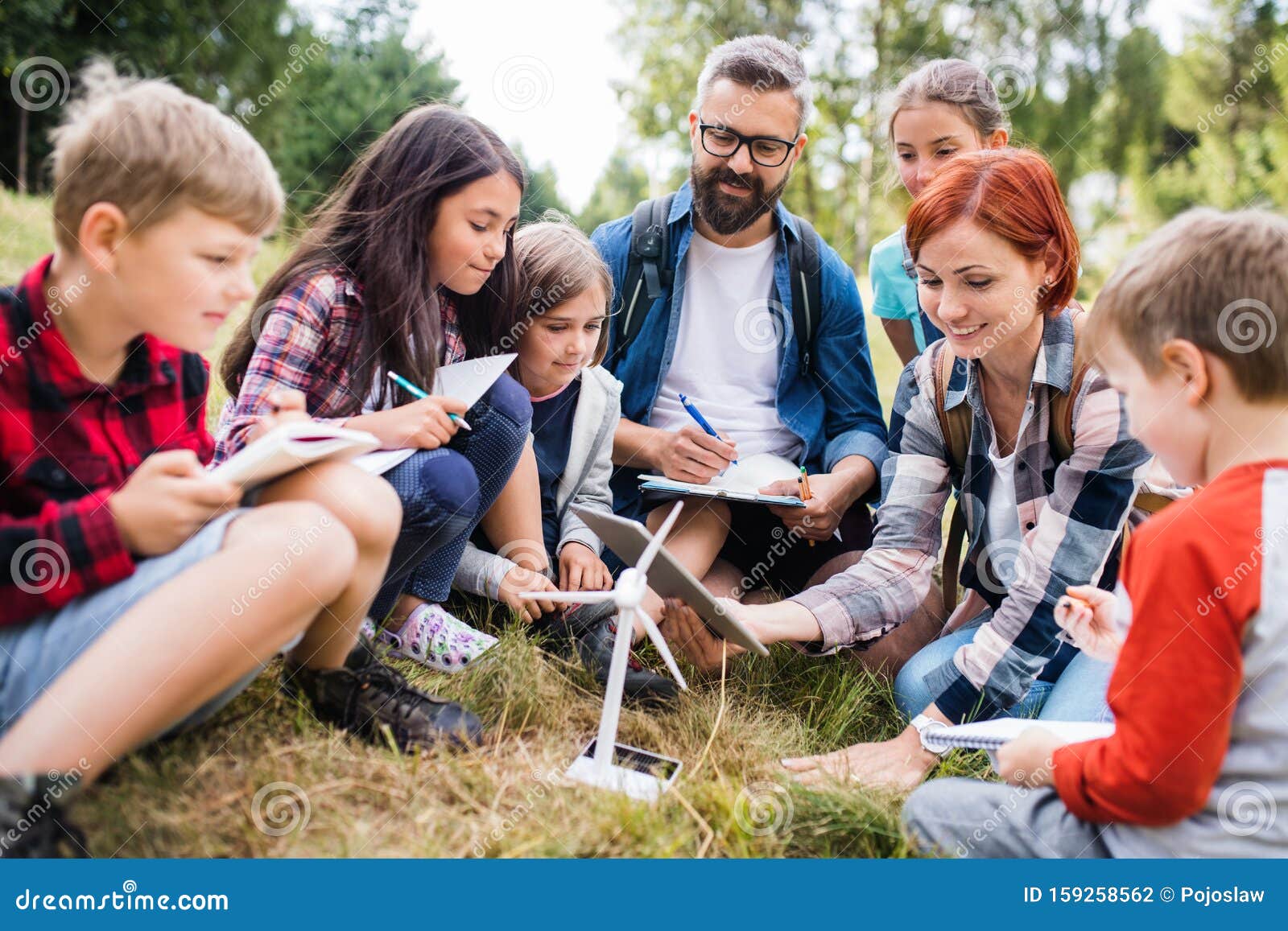 Group of School Children with Teacher and Windmill Model on Field Trip ...