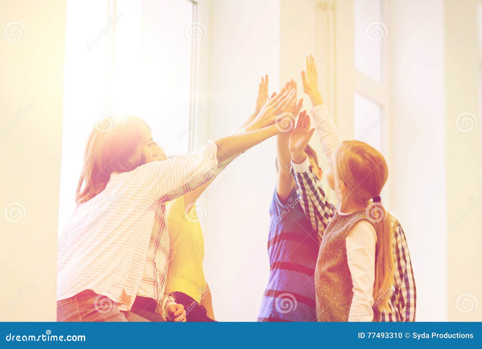 Group of School Kids Making High Five Gesture Stock Photo - Image of ...