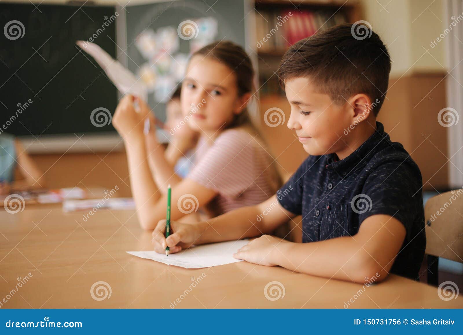 Group of School Kids with Pens and Notebooks Writing Test in Classroom ...