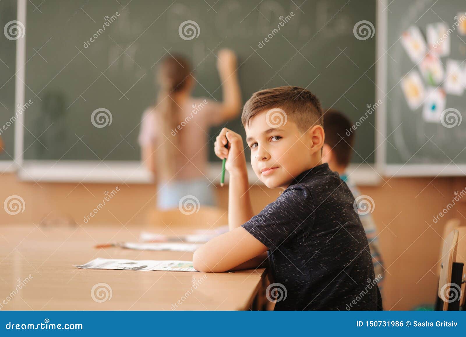 Group Of School Kids With Pens And Notebooks Writing Test In Classroom ...