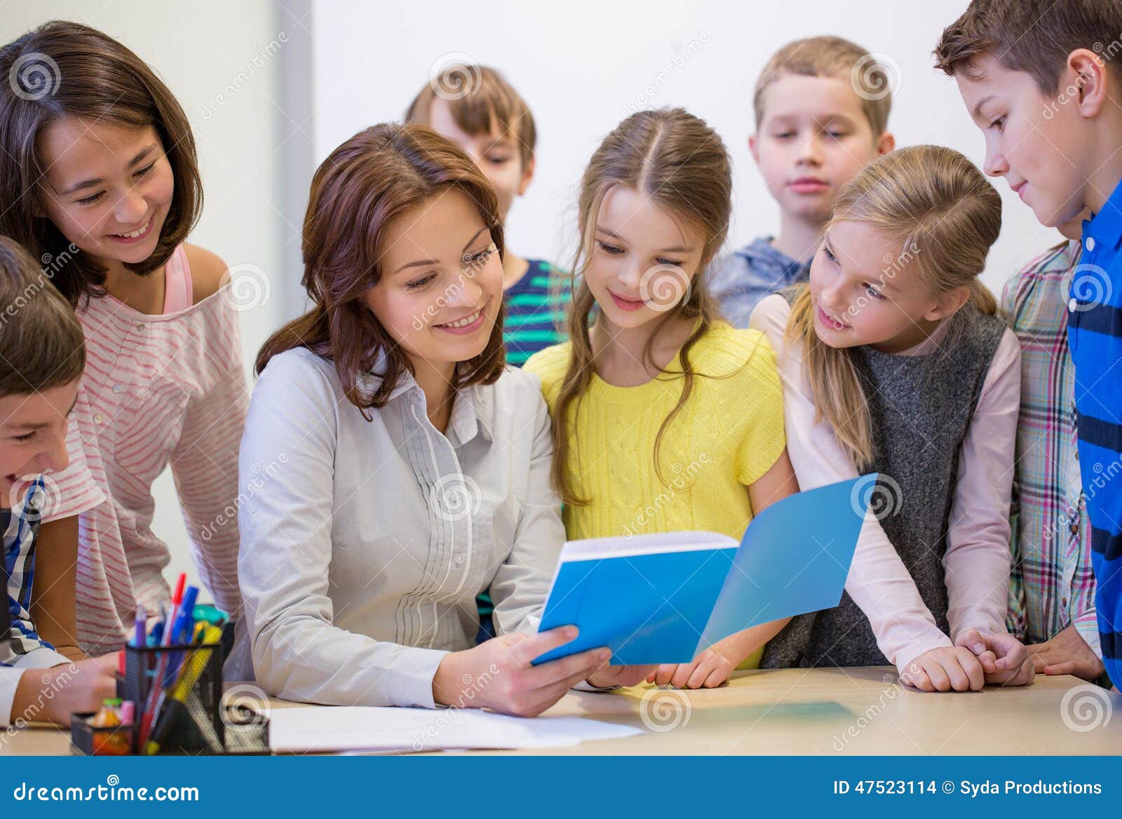 Group of School Kids with Teacher in Classroom Stock Photo - Image of ...