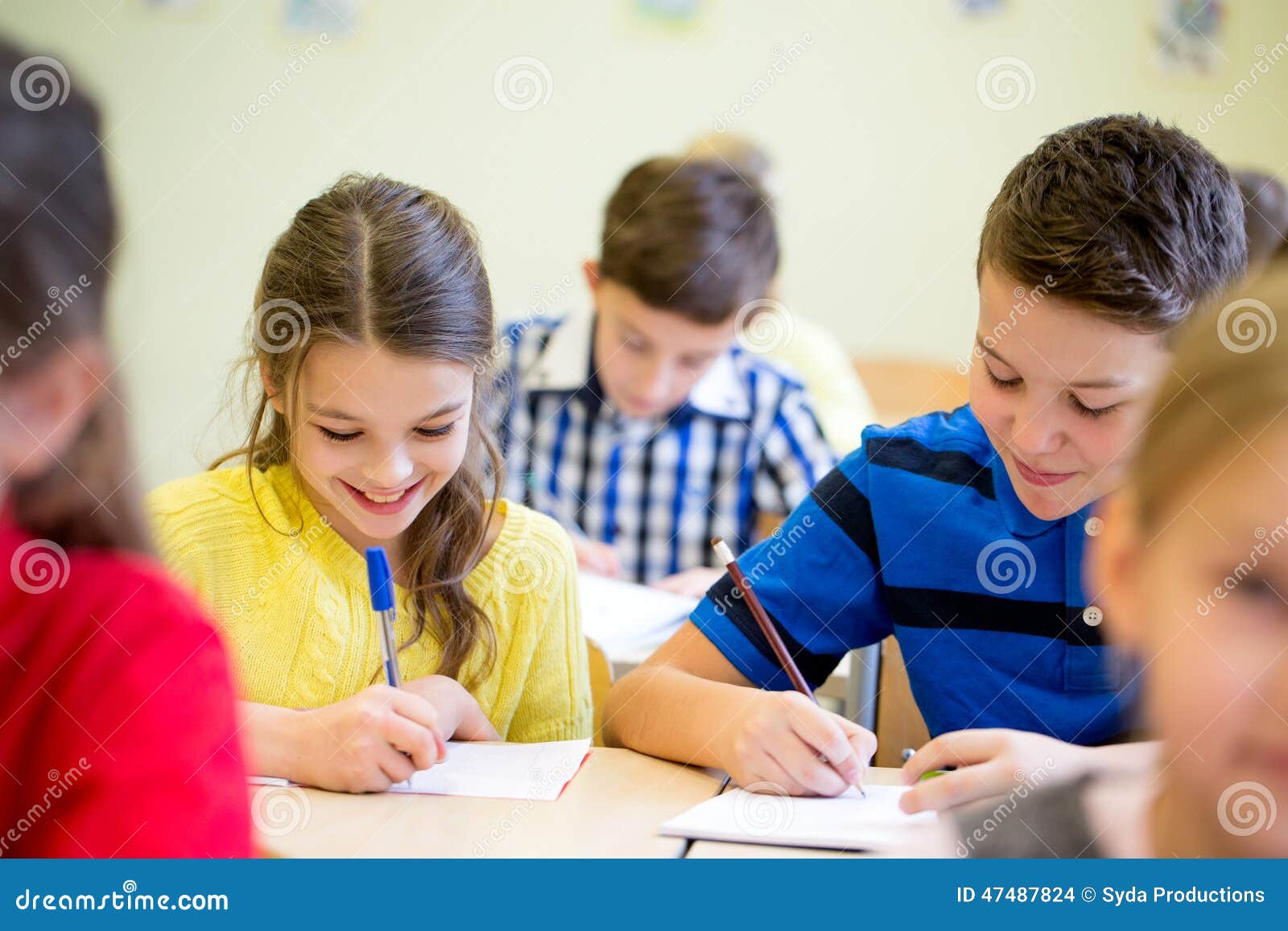 Group of School Kids Writing Test in Classroom Stock Photo - Image of ...