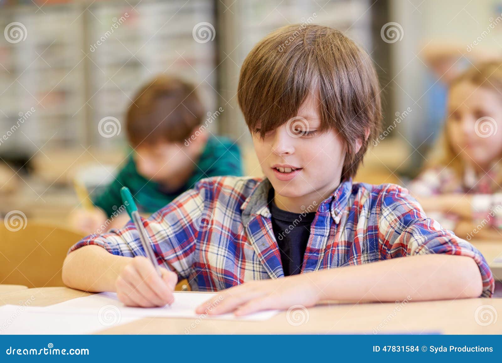 Group of School Kids Writing Test in Classroom Stock Photo - Image of ...