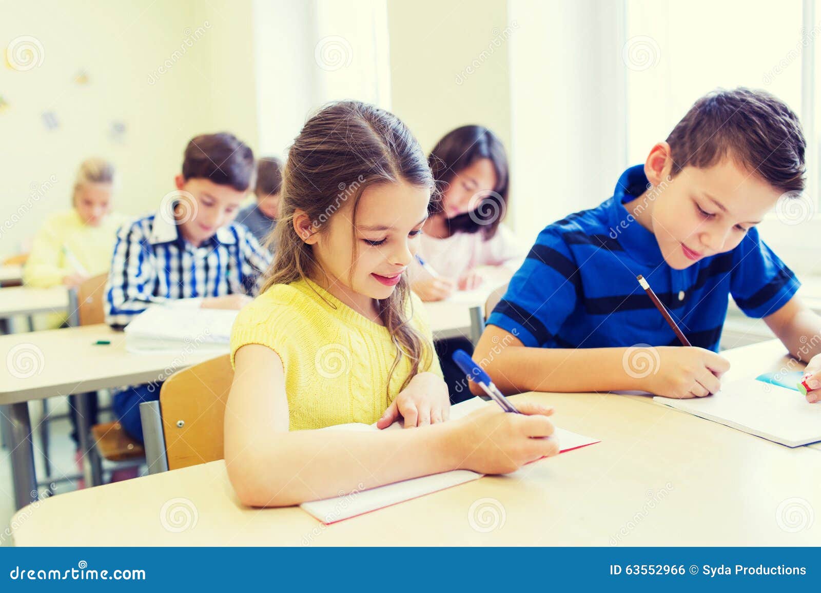 Group of School Kids Writing Test in Classroom Stock Photo - Image of ...