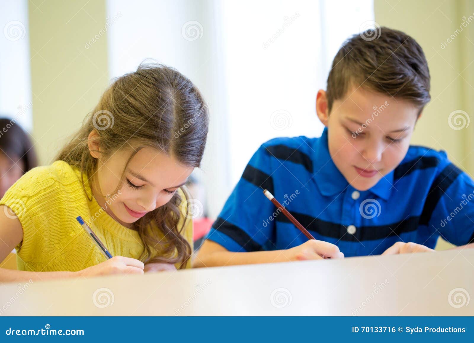 Group of School Kids Writing Test in Classroom Stock Photo - Image of ...