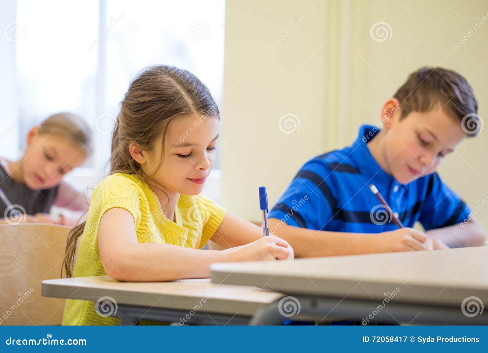 Group of School Kids Writing Test in Classroom Stock Image - Image of ...