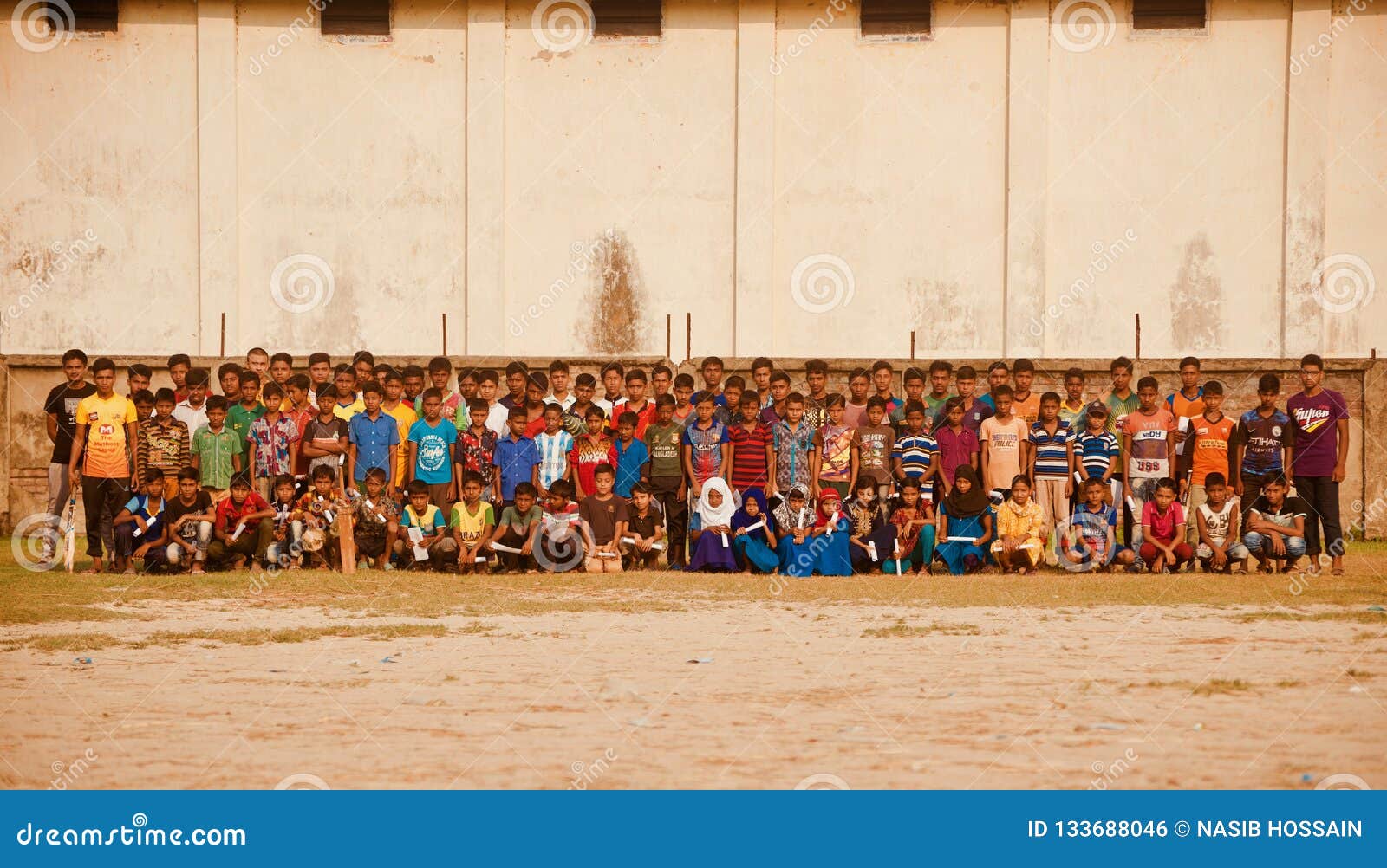 A Man Sitting On The Ground With Musical Note Pattern Background ...