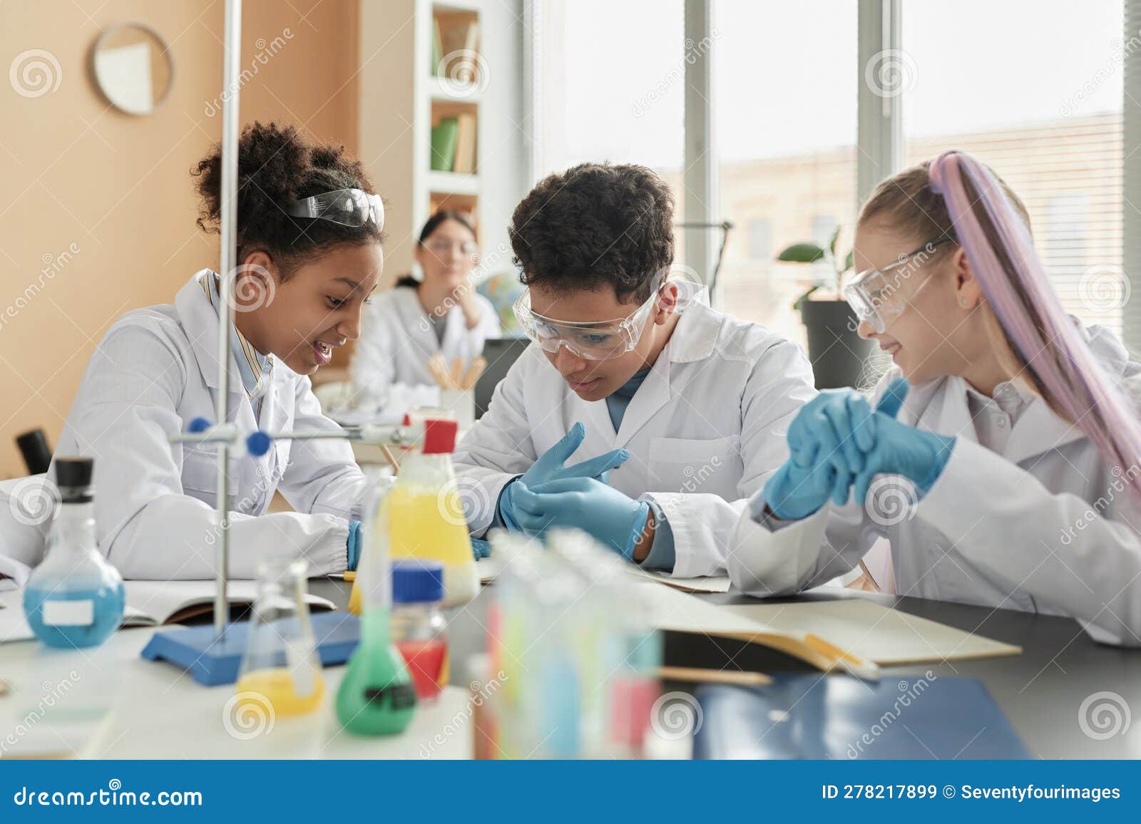 Group of Schoolchildren Enjoying Science Experiments in Class Stock ...