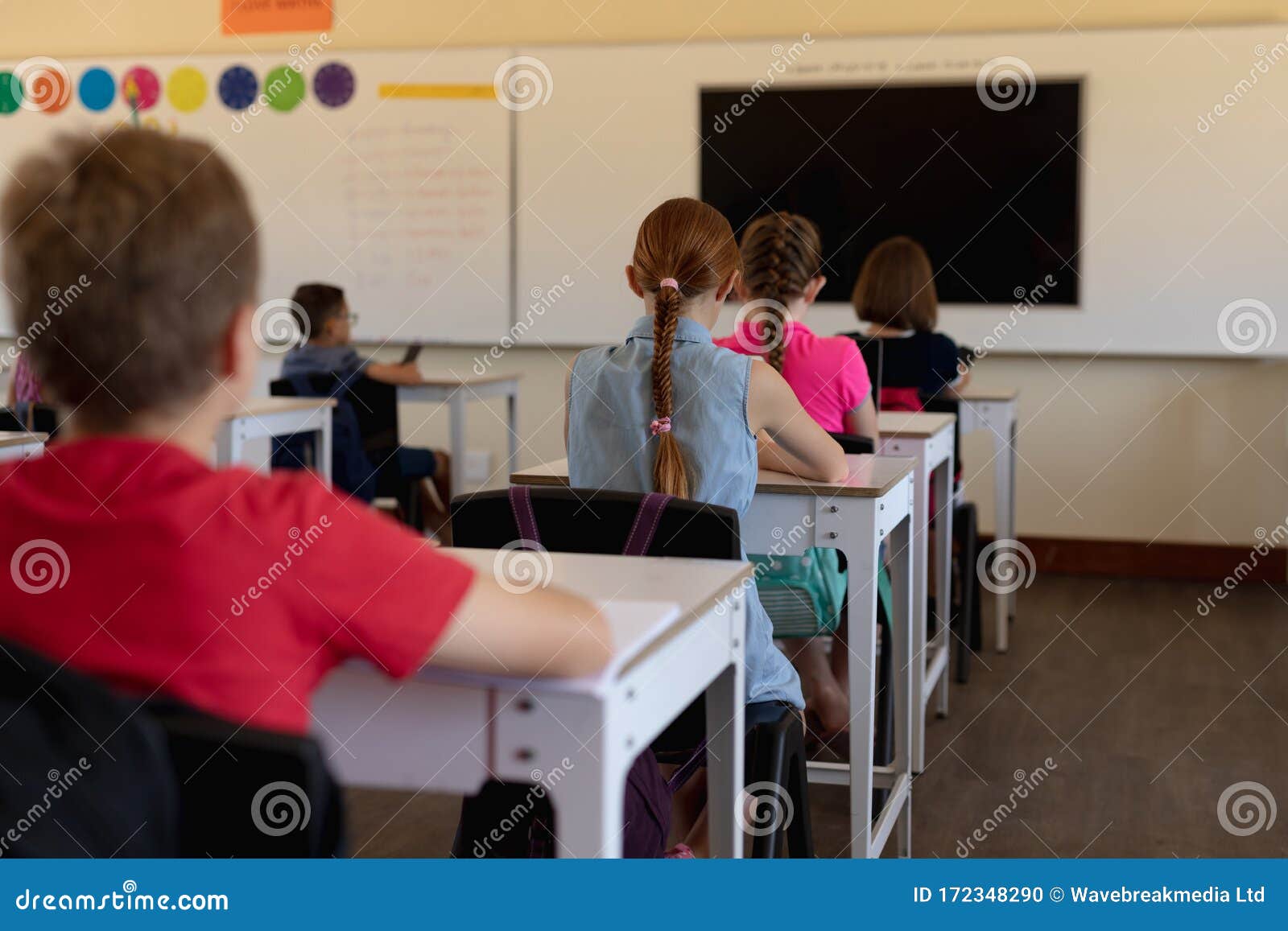 Group of Schoolchildren Sitting at Desks in an Elementary School ...