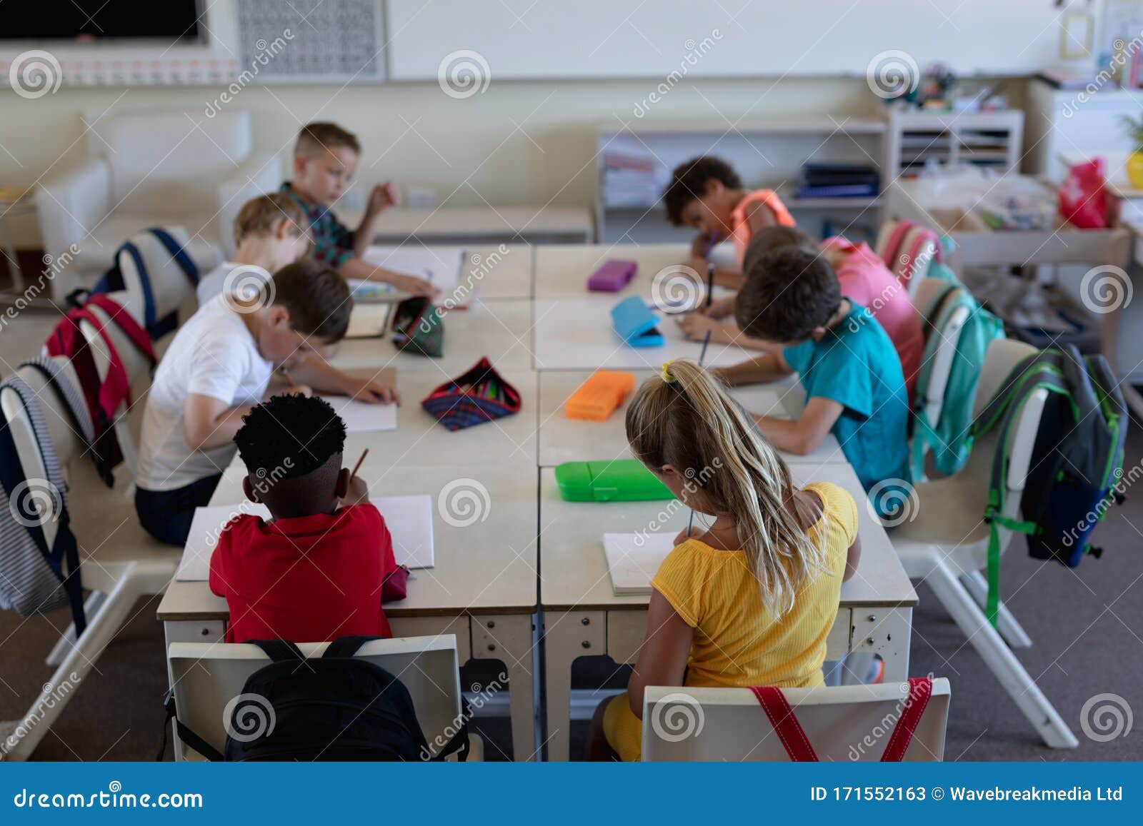Group of Schoolchildren Working in an Elementary School Classroom Stock ...