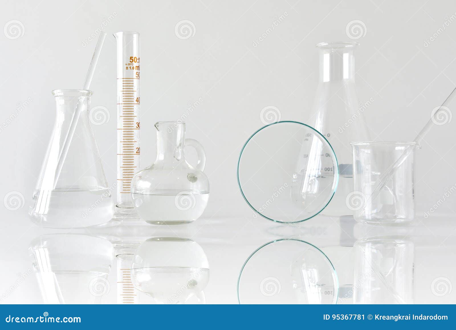 Group of Scientific Laboratory Glassware with Clear Liquid Solution ...