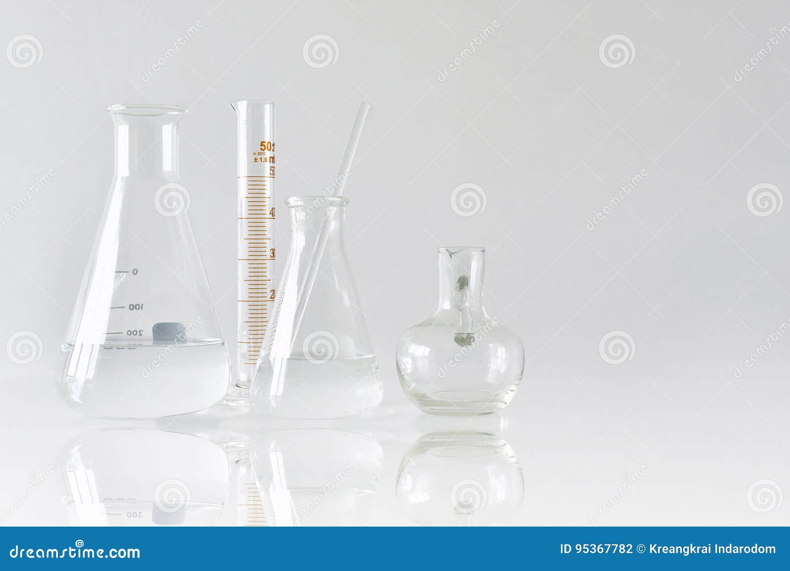 Group of Scientific Laboratory Glassware with Clear Liquid Solution ...