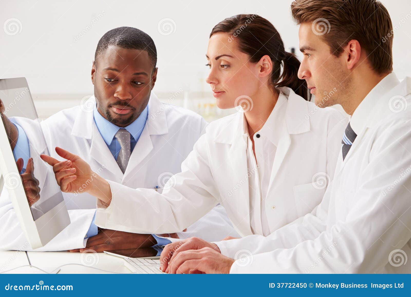 Group of Scientists Checking Laboratory Results on Computer Stock Photo ...