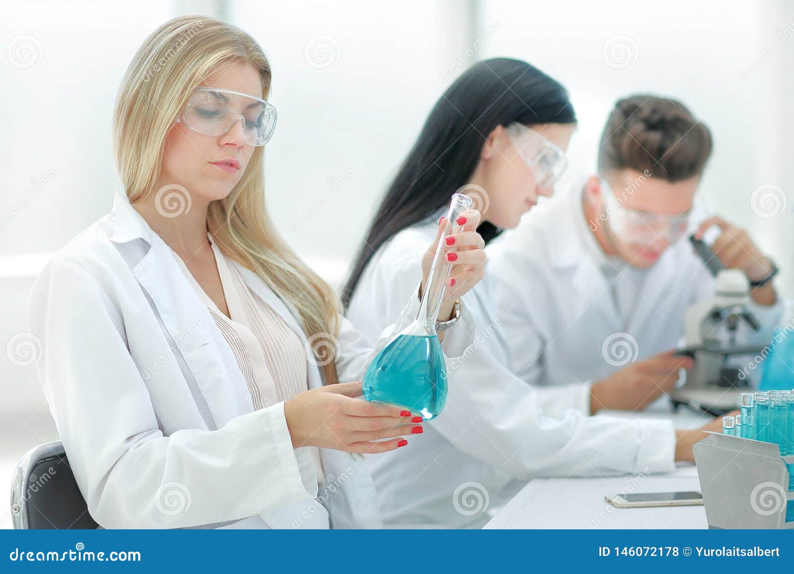 Group of Scientists Conduct Research in the Laboratory Stock Photo ...