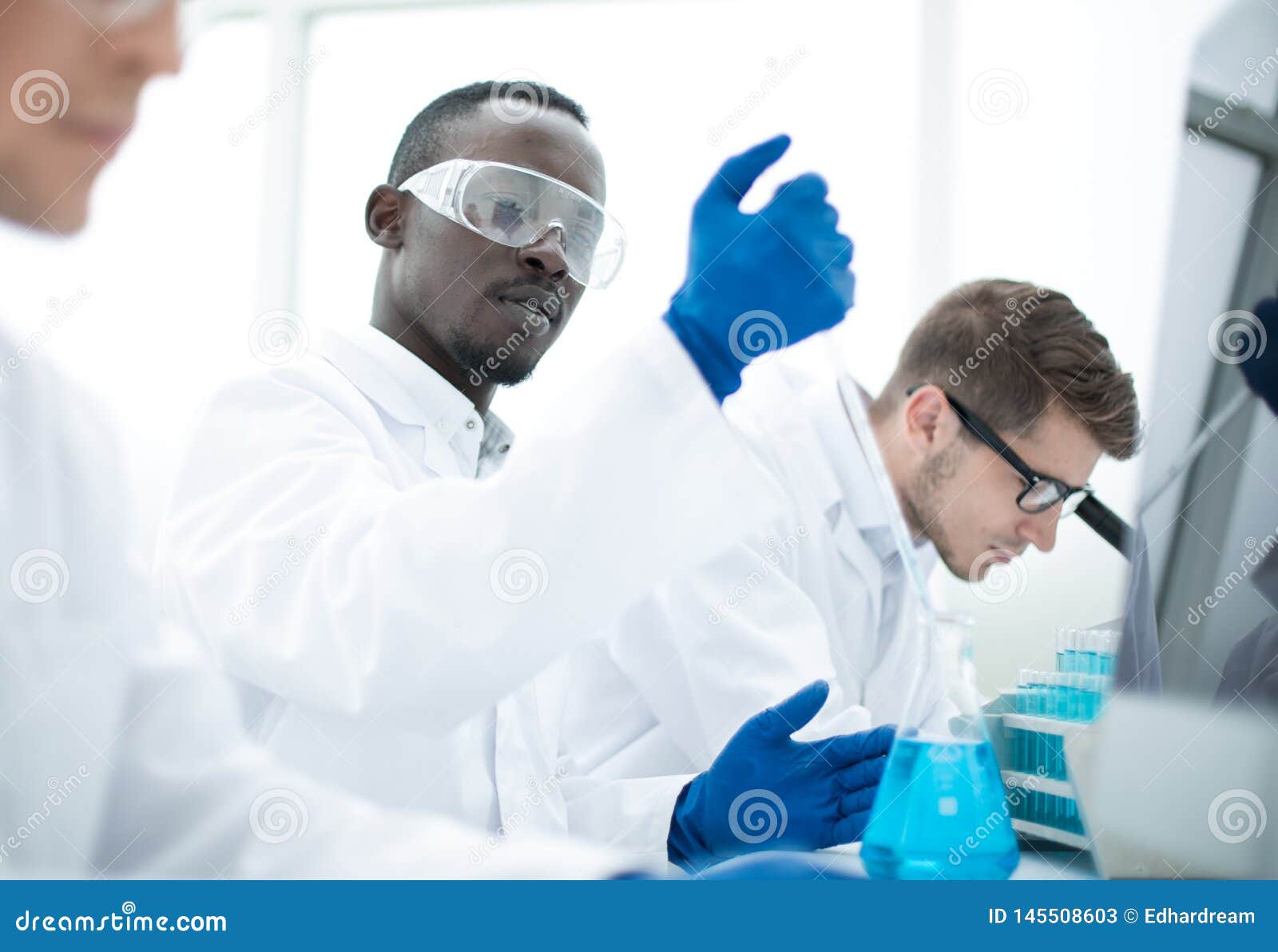 Group of Scientists are Conducting Experiments with the Liquid Stock ...