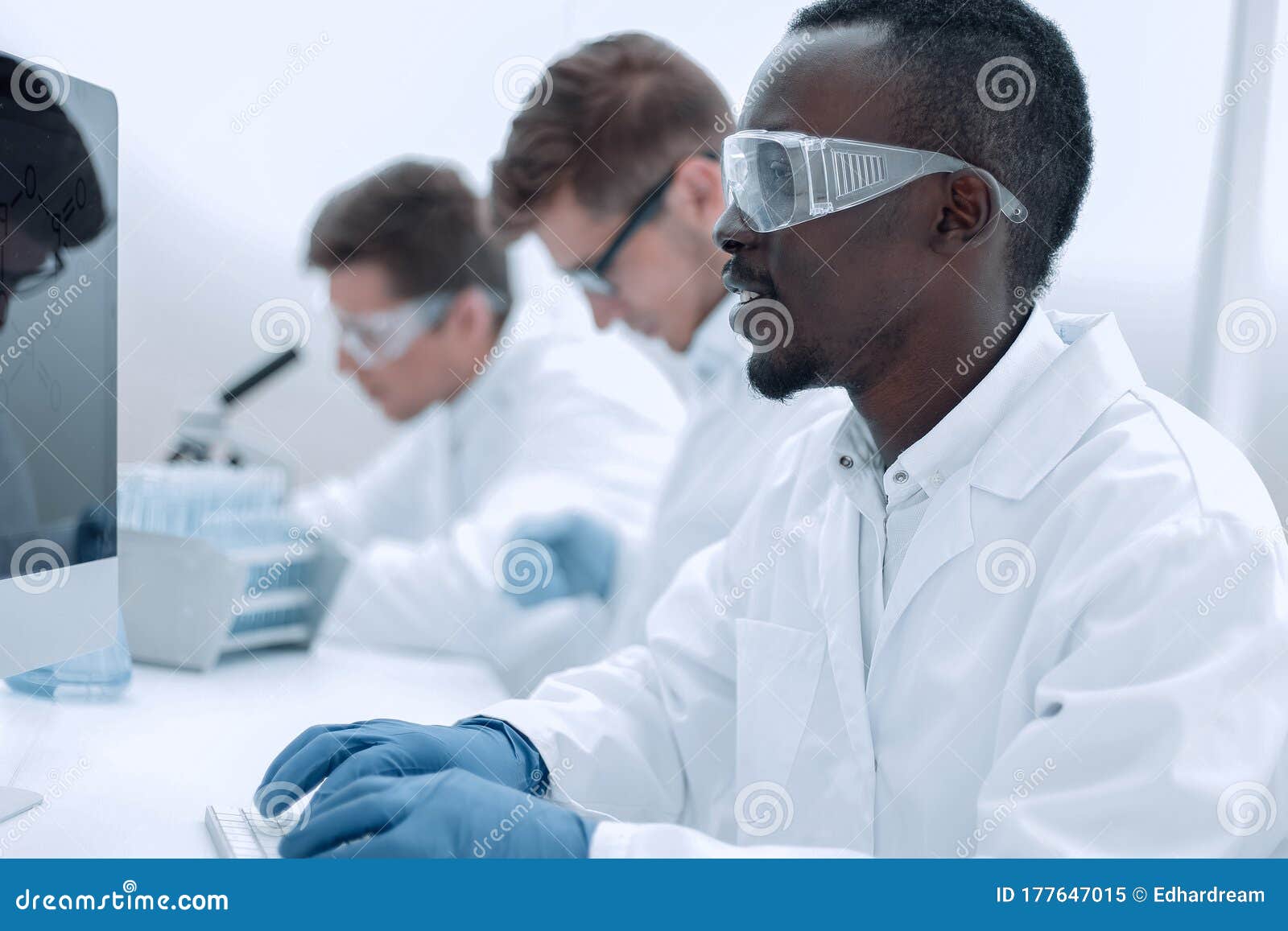 Group of Scientists are Conducting Experiments with the Liquid Stock ...