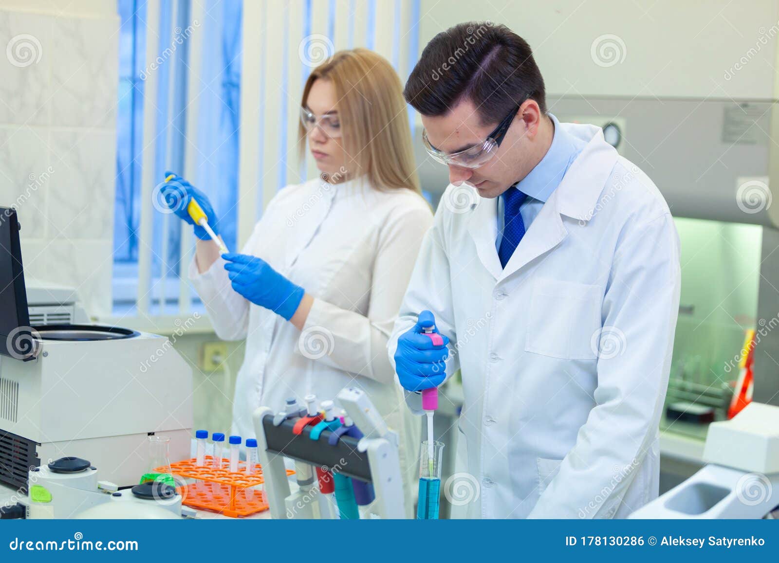 A Group of Scientists Conducts Research in a Scientific Laboratory ...