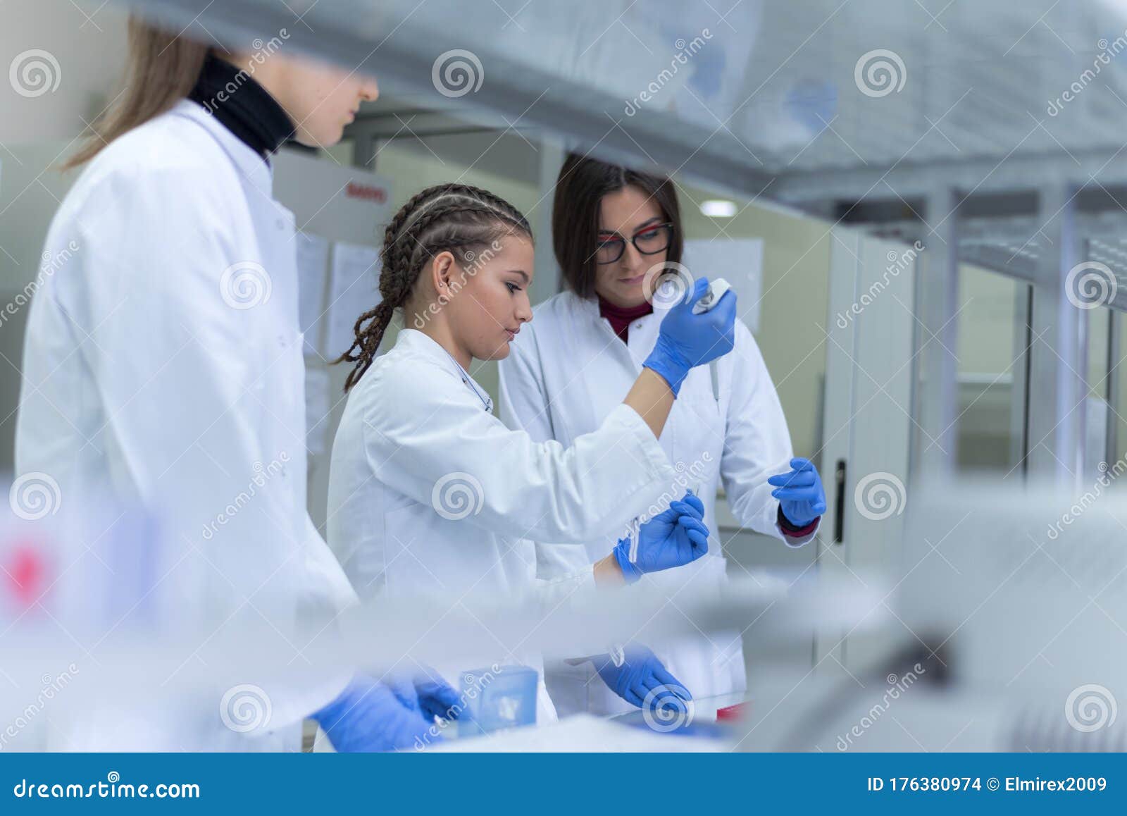 A Group of Scientists Conducts Research in a Scientific Laboratory ...