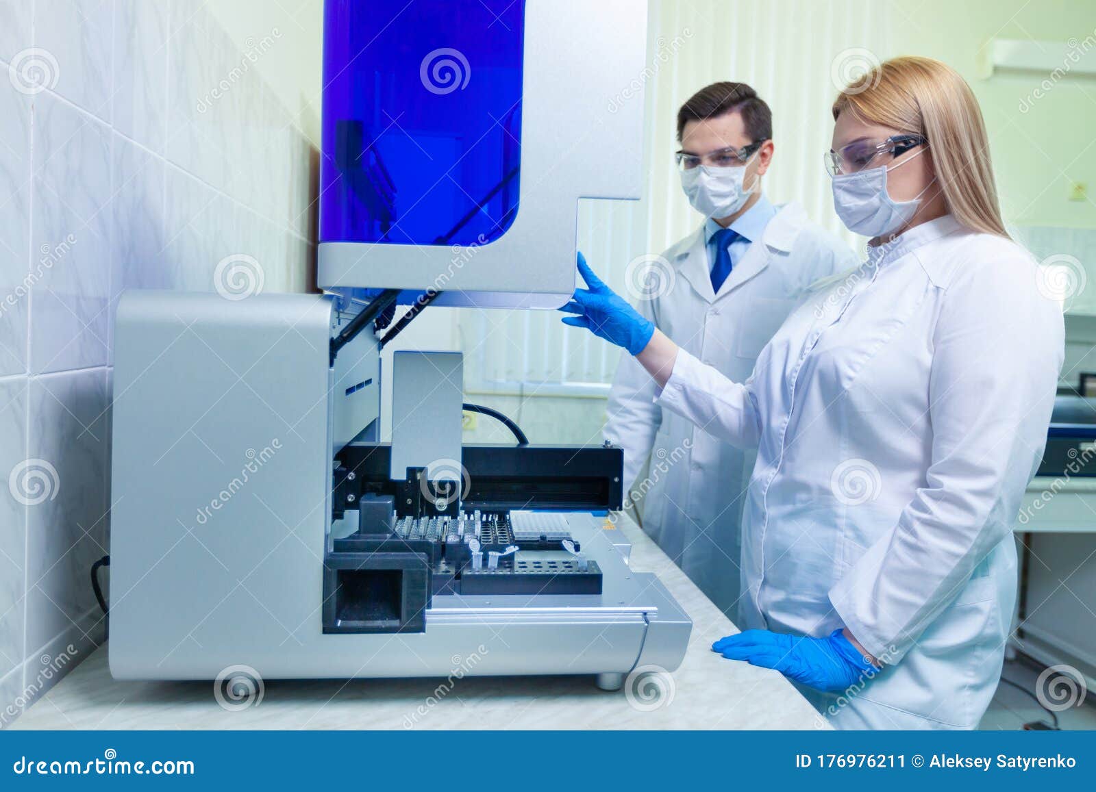 A Group of Scientists Conducts Research in a Scientific Laboratory ...