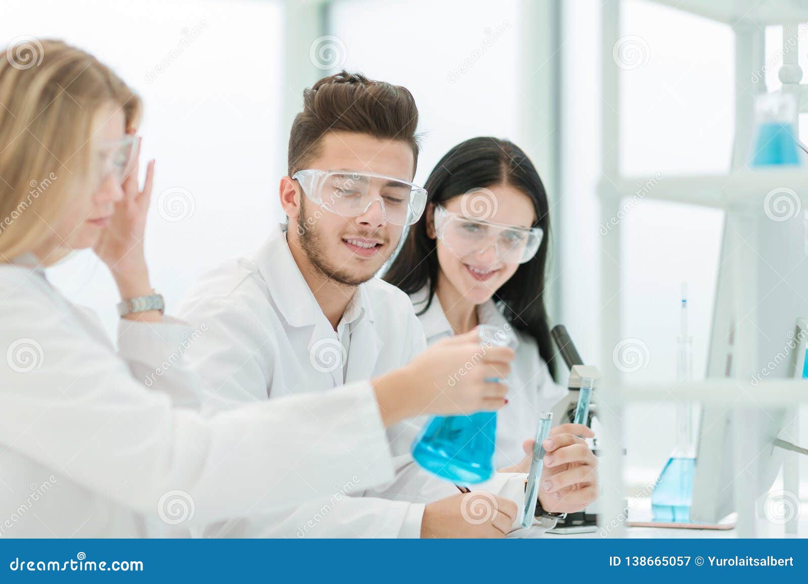 Group of Scientists Discuss the Liquid in the Flask. Stock Image ...