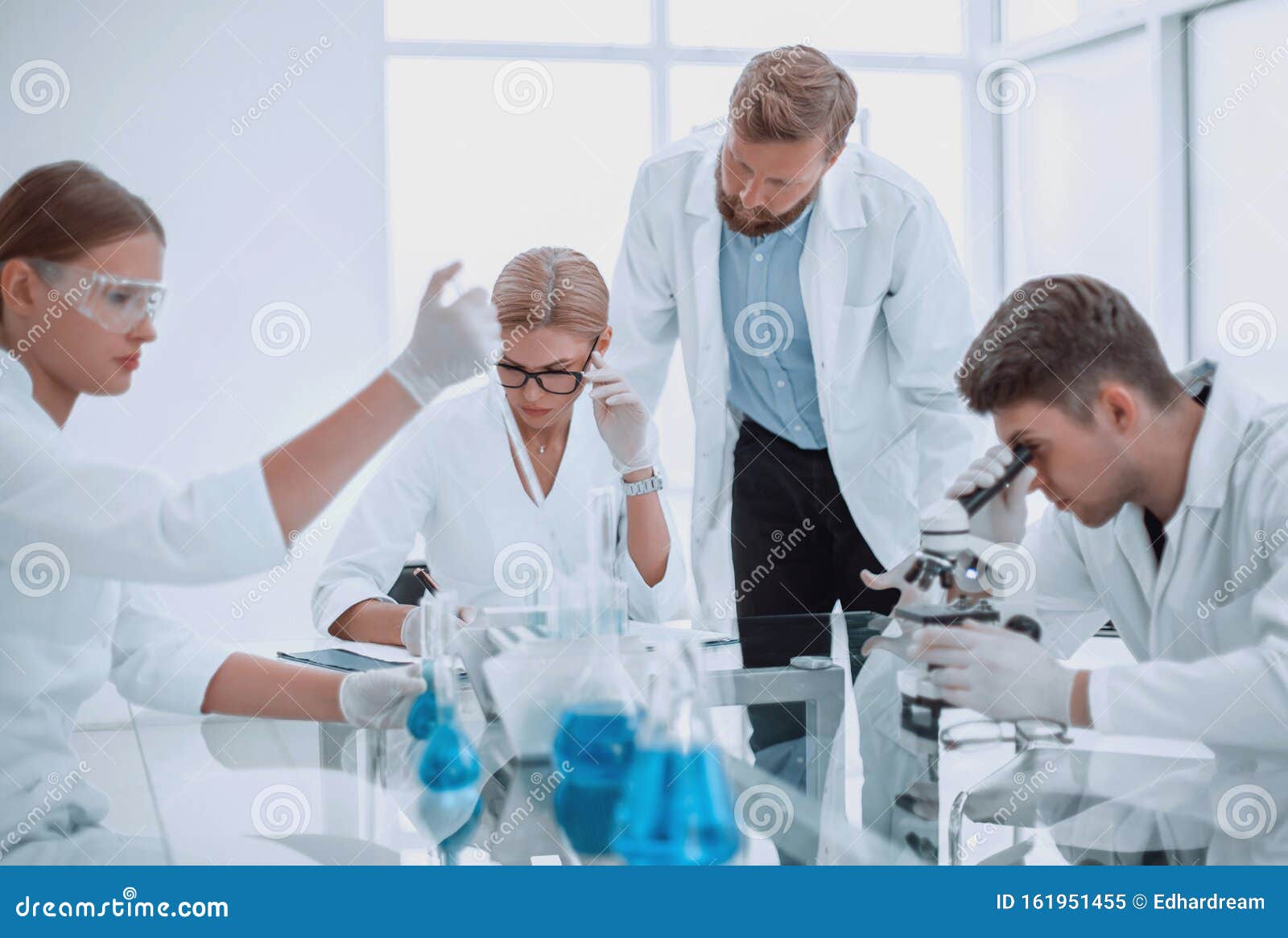Group of Scientists and Doctors Sitting at a Laboratory Table Stock ...
