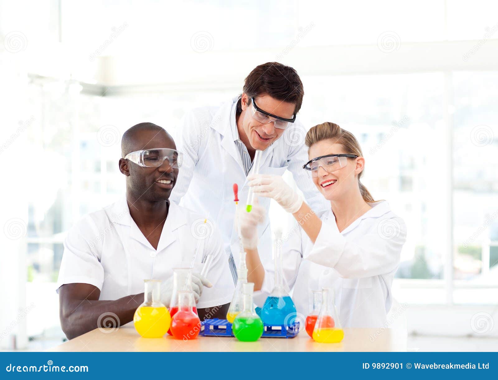 Group of Scientists Examining Test-tubes Stock Image - Image of ...