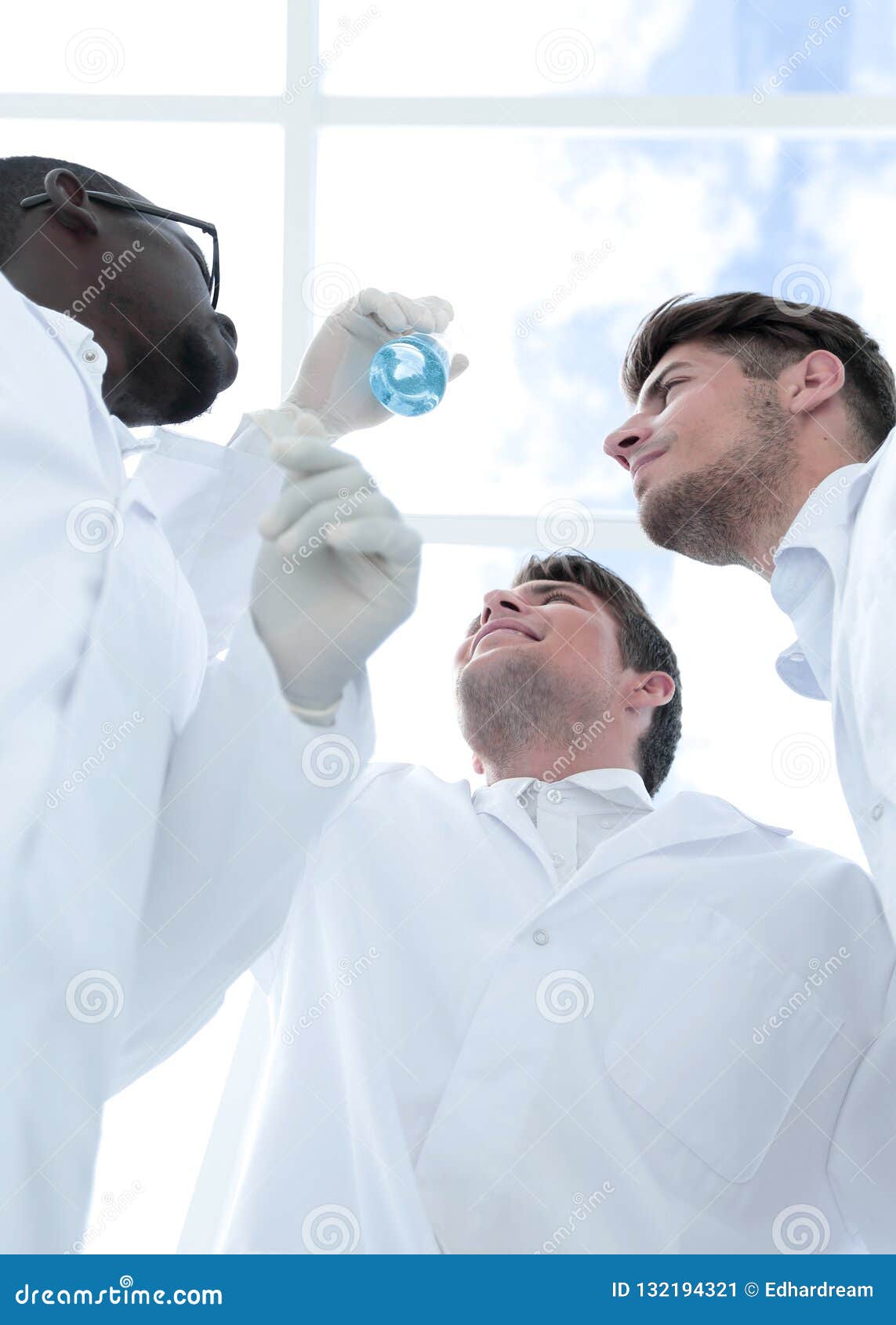 Group of Scientists Looking at the Results of Their Experiment. Stock ...