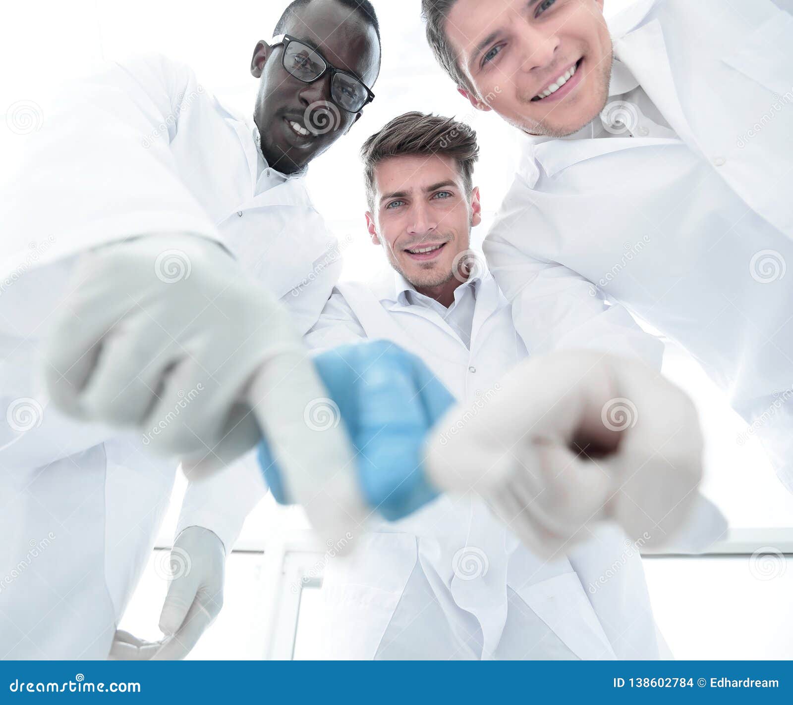 Group of Scientists Pointing To the Laboratory Table Stock Photo ...