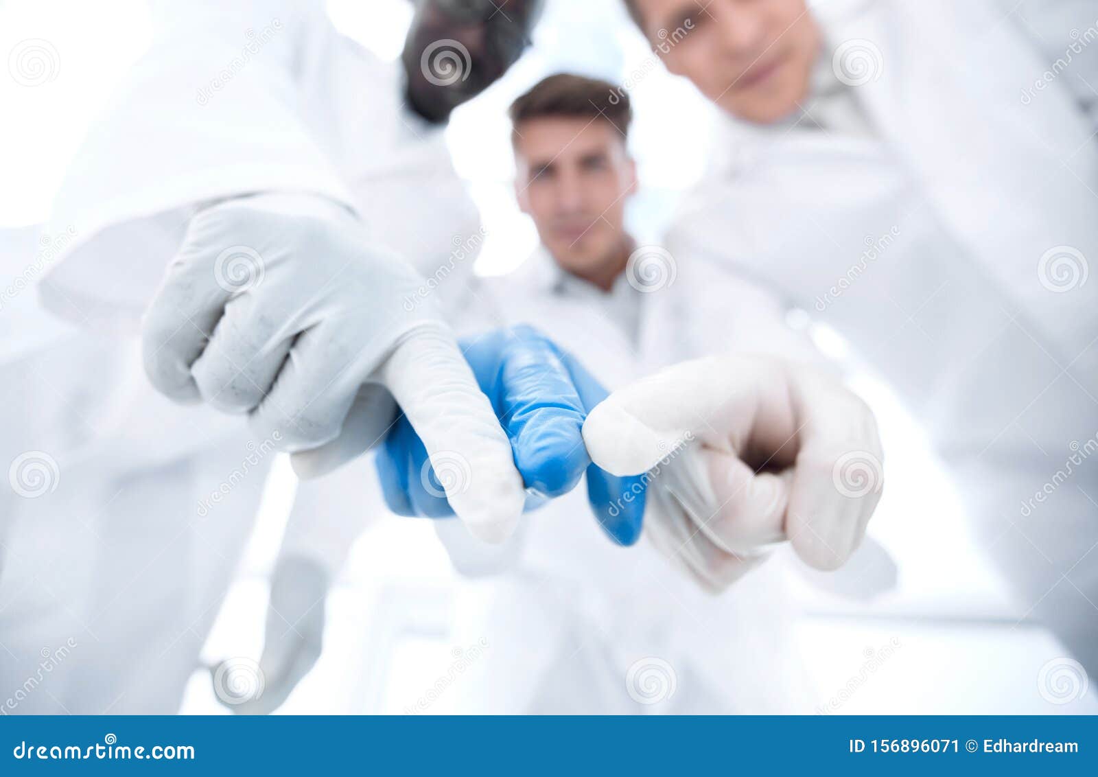 Group of Scientists Pointing To the Laboratory Table Stock Image ...