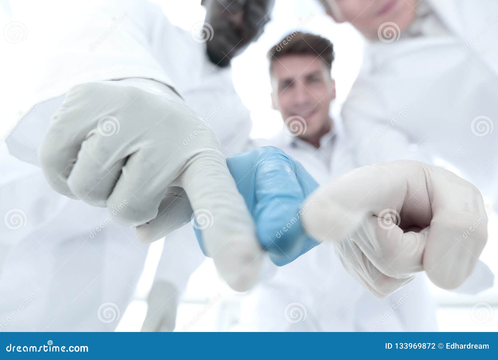 Group of Scientists Pointing To the Laboratory Table Stock Photo ...